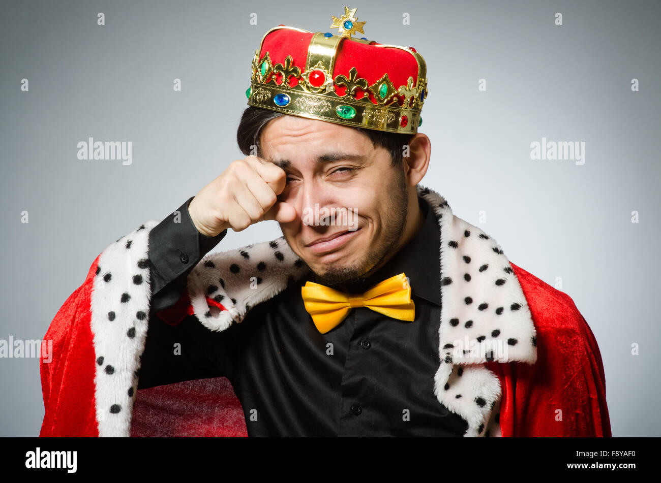 Concept with funny man wearing crown Stock Photo - Alamy
