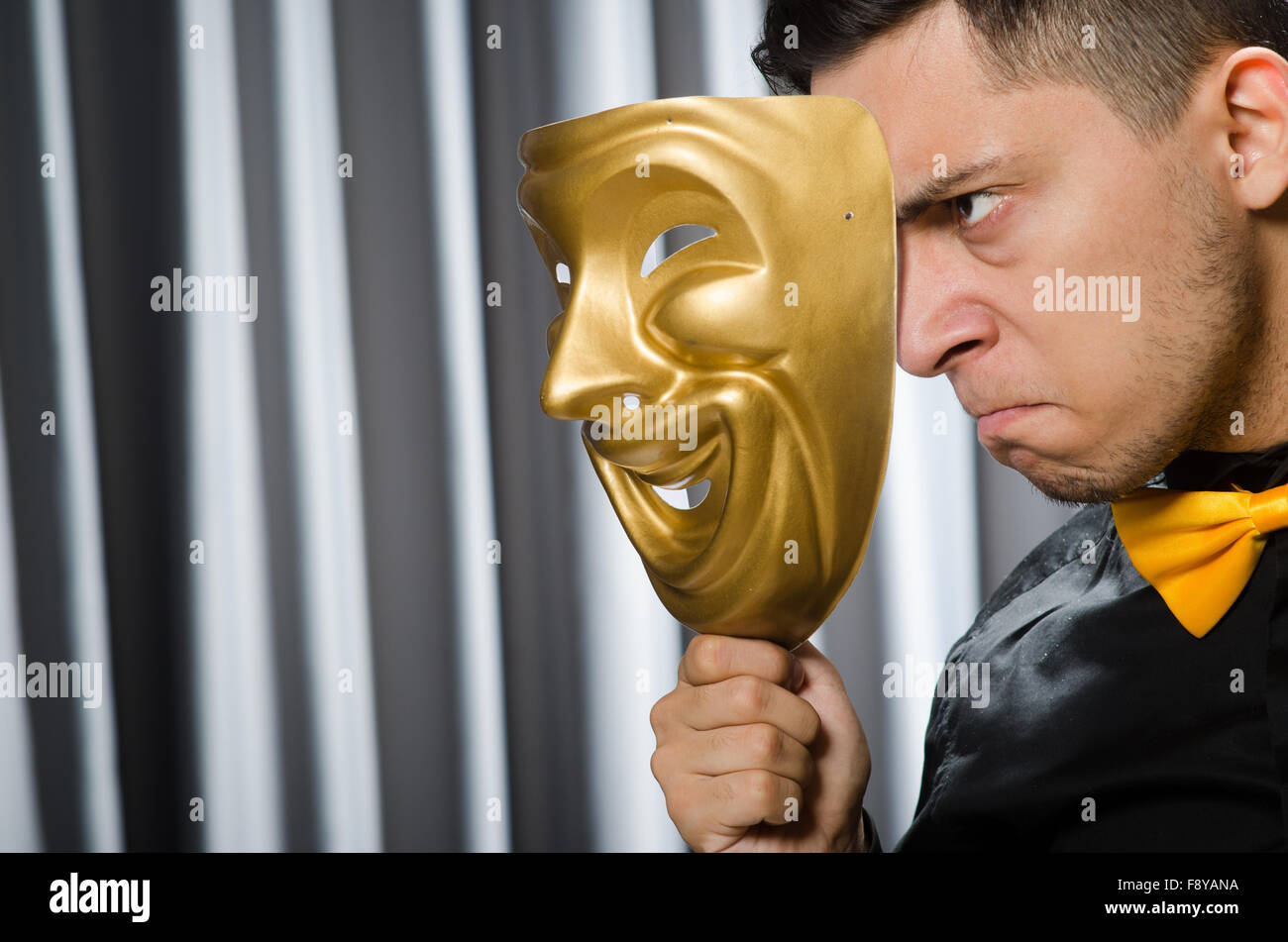 Funny concept with theatrical mask Stock Photo - Alamy