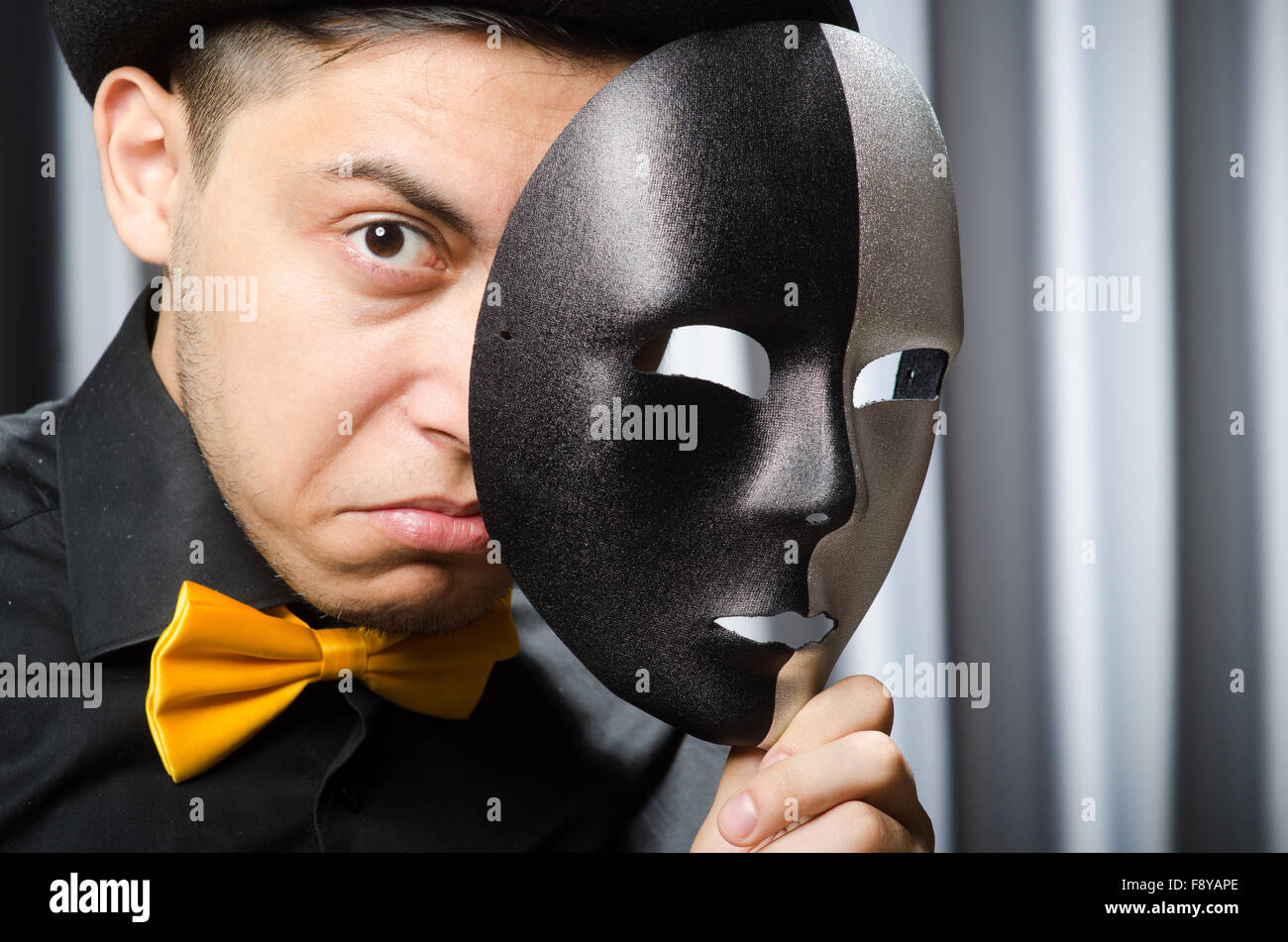 Funny concept with theatrical mask Stock Photo - Alamy