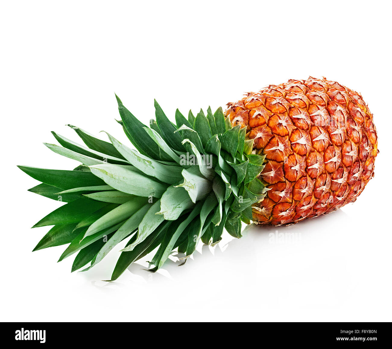 Ripe whole tasty pineapple close-up isolated on a white background ...