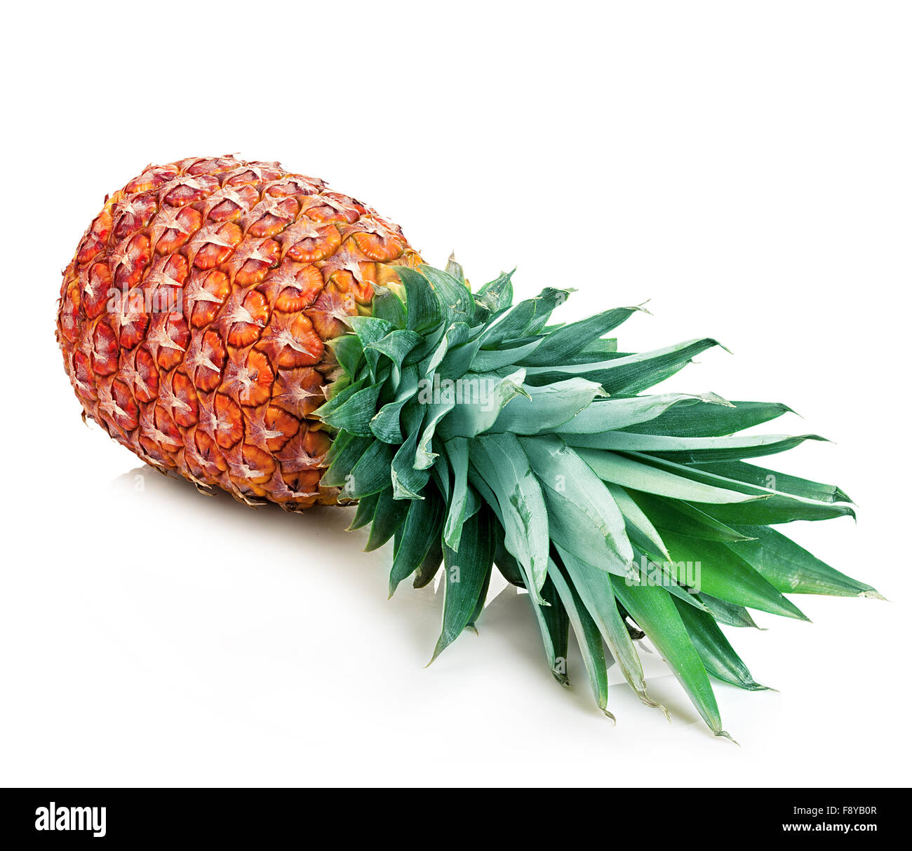 Ripe whole tasty pineapple close-up isolated on a white background ...