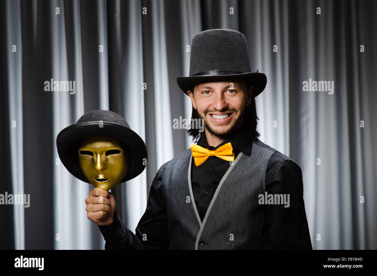 Funny concept with theatrical mask Stock Photo - Alamy