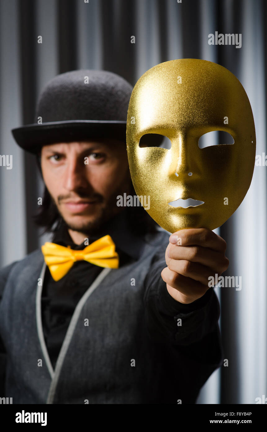 Funny concept with theatrical mask Stock Photo - Alamy