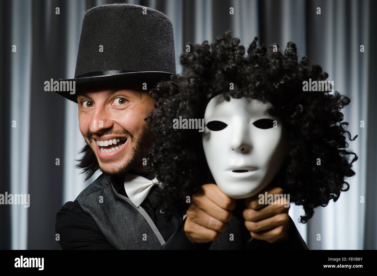 Funny concept with theatrical mask Stock Photo - Alamy