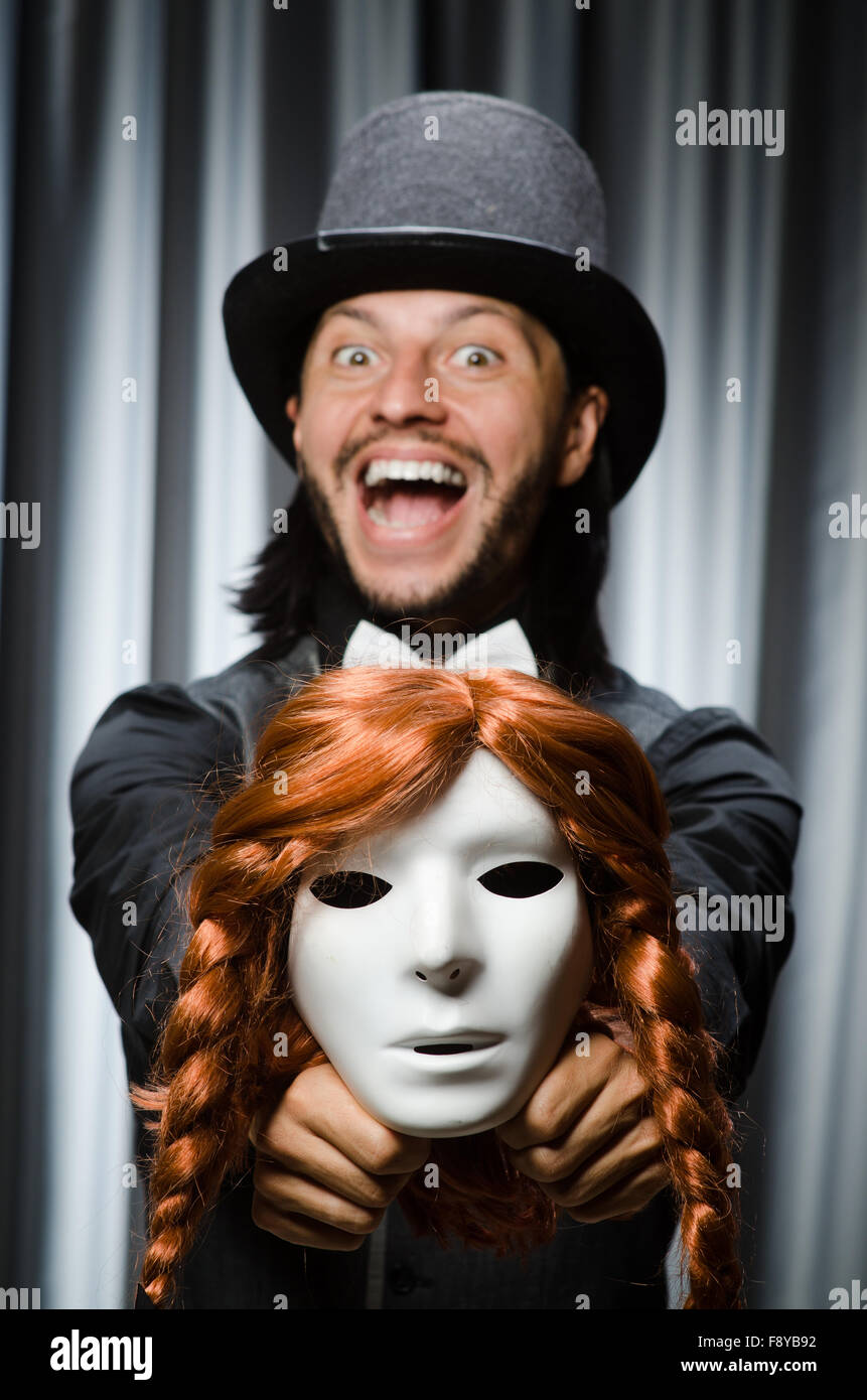 Funny concept with theatrical mask Stock Photo - Alamy