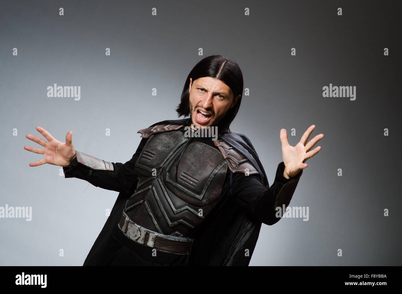 Angry warrior against dark background Stock Photo - Alamy