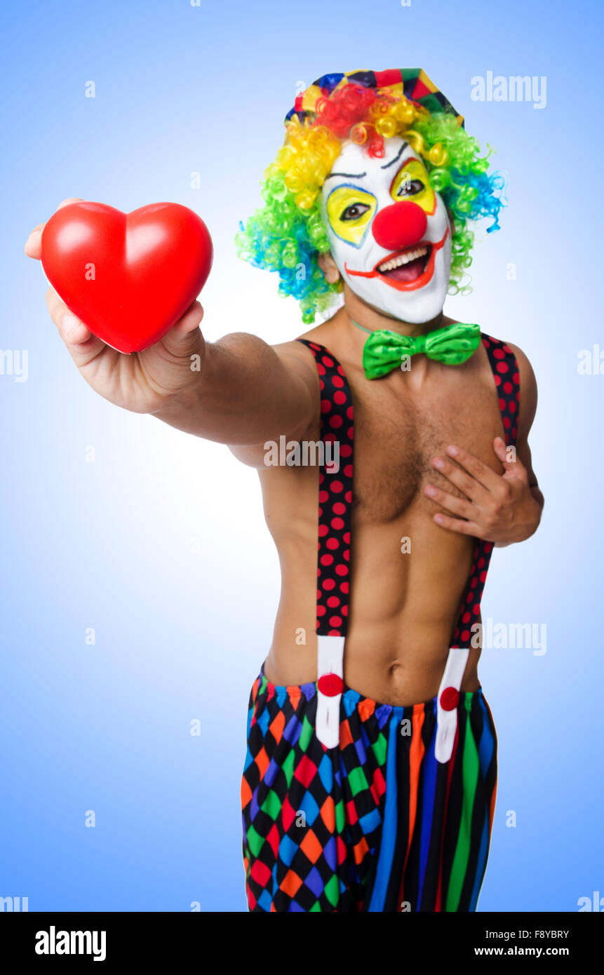 Clown with heart isolated on white Stock Photo - Alamy