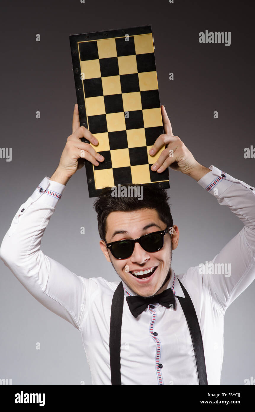 Funny chess player with board Stock Photo - Alamy