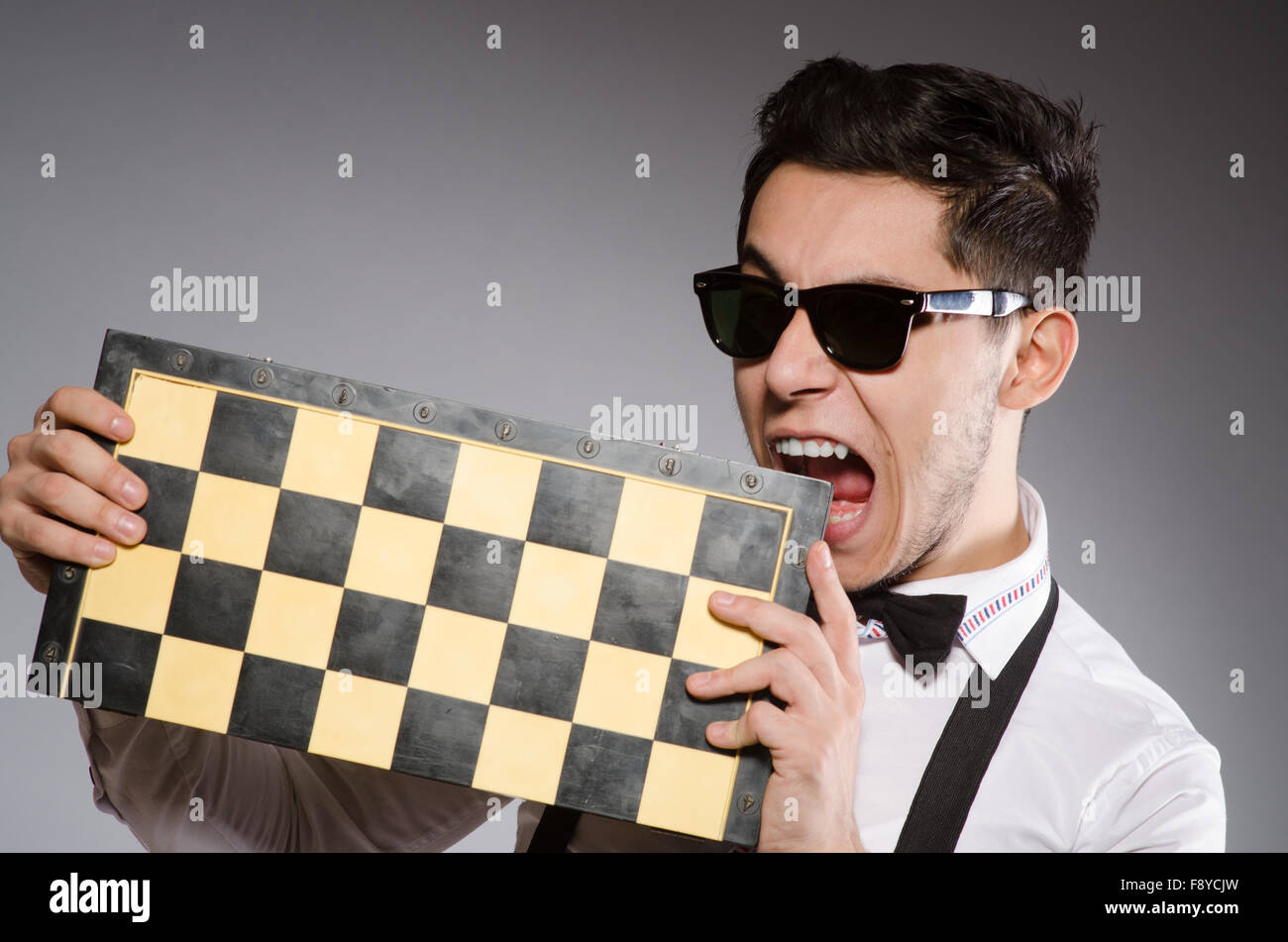 Funny chess player with board Stock Photo - Alamy