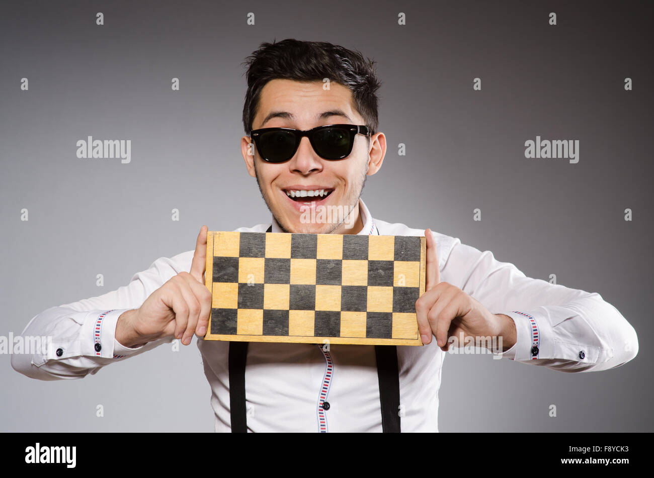 Funny chess player with board Stock Photo - Alamy