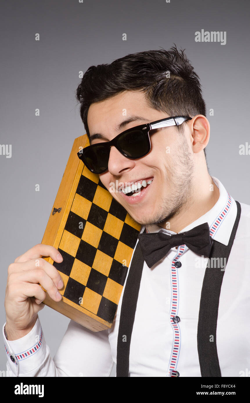 Funny chess player with board Stock Photo - Alamy
