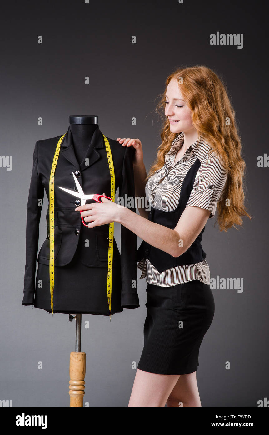 Woman tailor working on new dress Stock Photo - Alamy