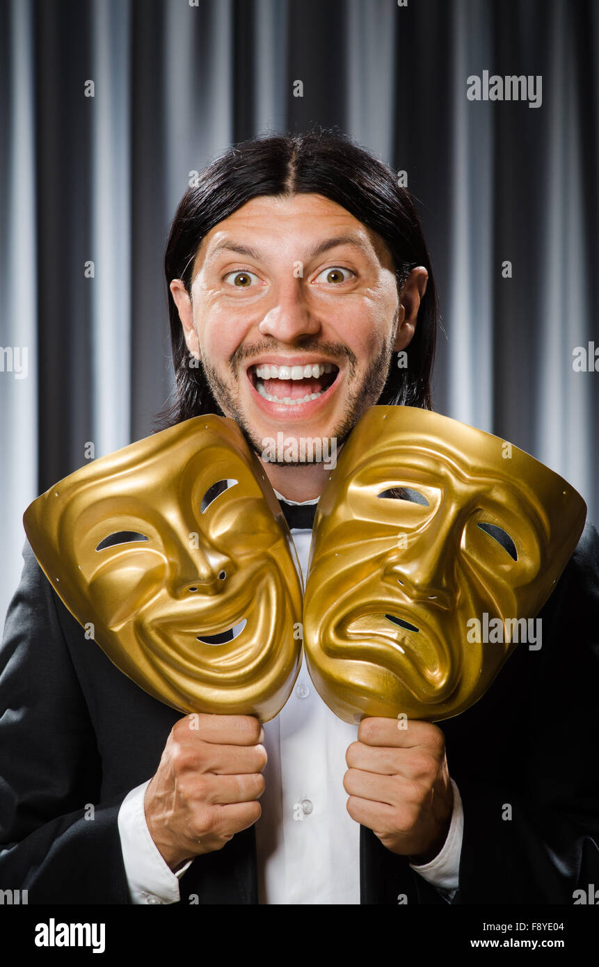 Funny concept with theatrical mask Stock Photo - Alamy