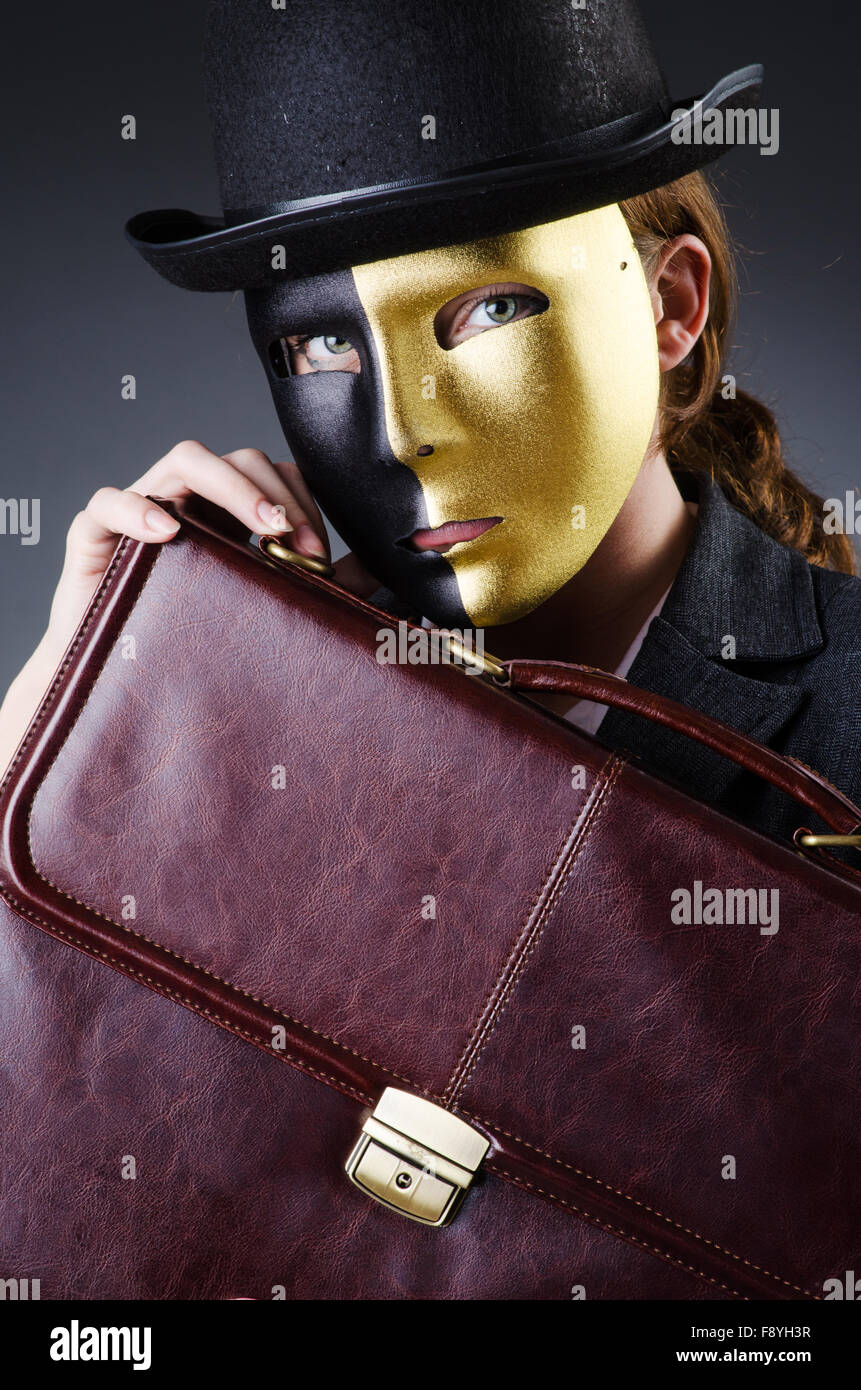 Woman with mask in hypocrisy concept Stock Photo - Alamy