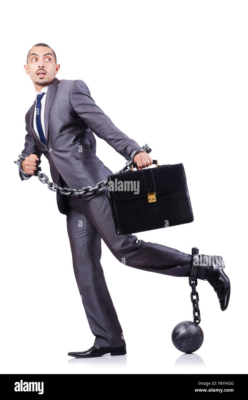 Businessman with shackles on white Stock Photo - Alamy
