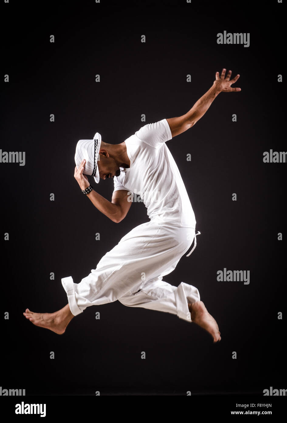 Dancer dancing dances in white clothing Stock Photo - Alamy