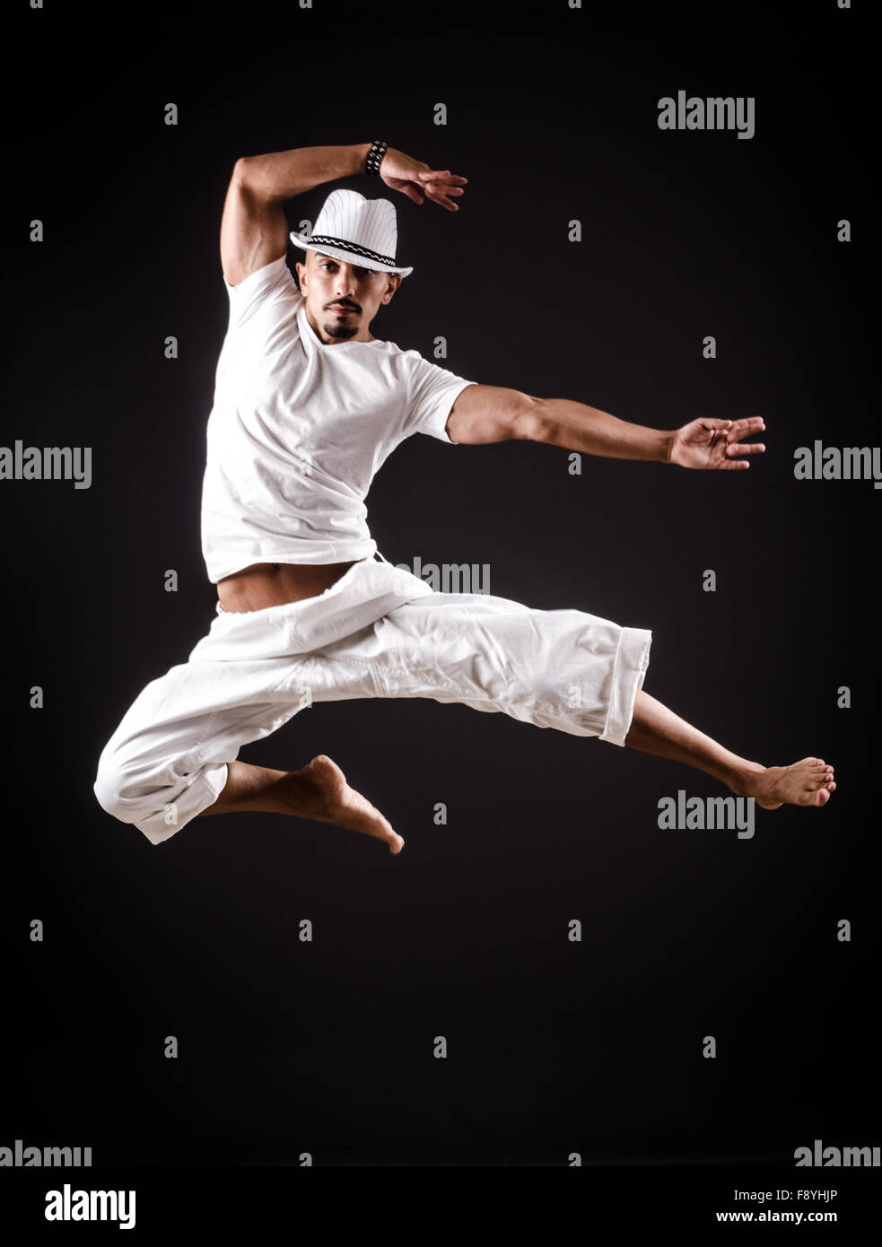 Dancer dancing dances in white clothing Stock Photo - Alamy