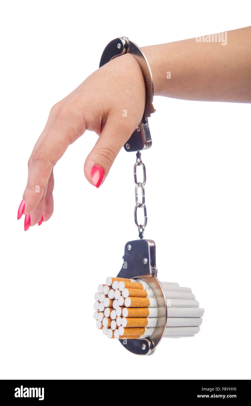 Addition concept with cigarettes and handcuffs Stock Photo - Alamy