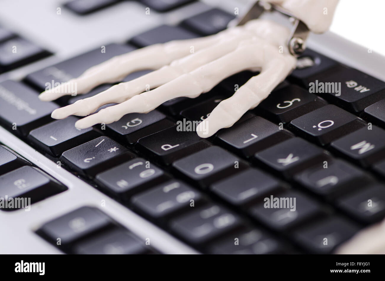 Skeleton working on the keyboard Stock Photo - Alamy