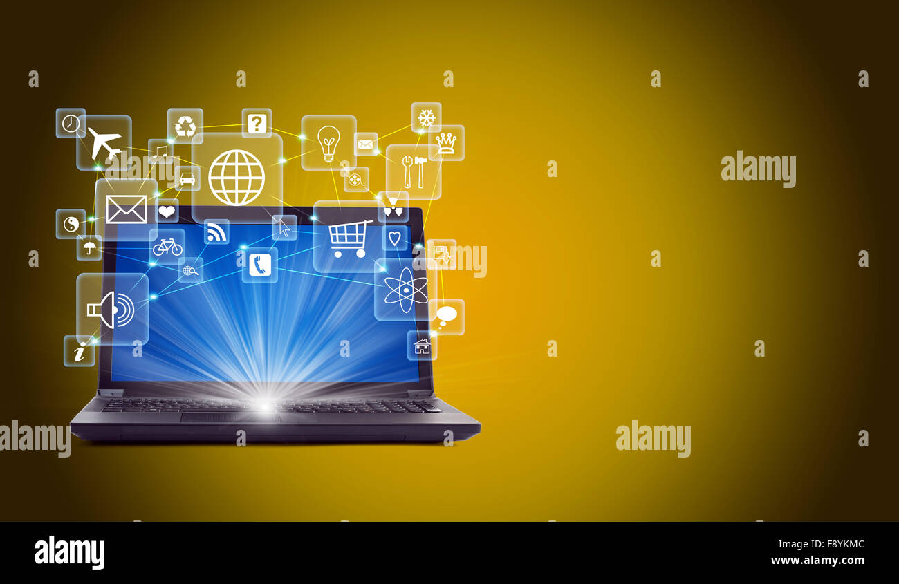 Laptop with lightspot and icons Stock Photo - Alamy