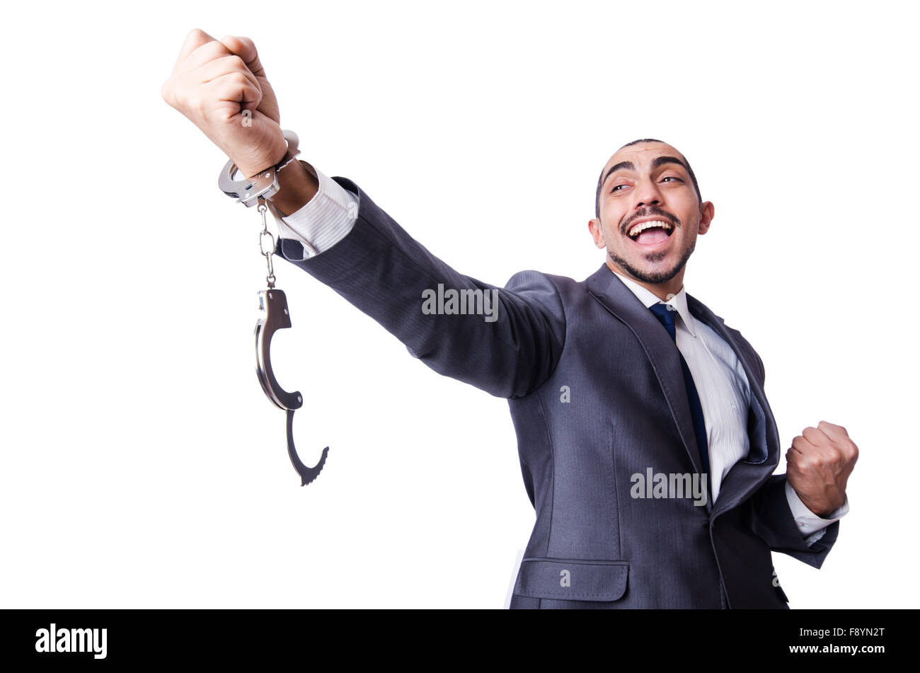 Funny businessman with handcuffs on white Stock Photo - Alamy