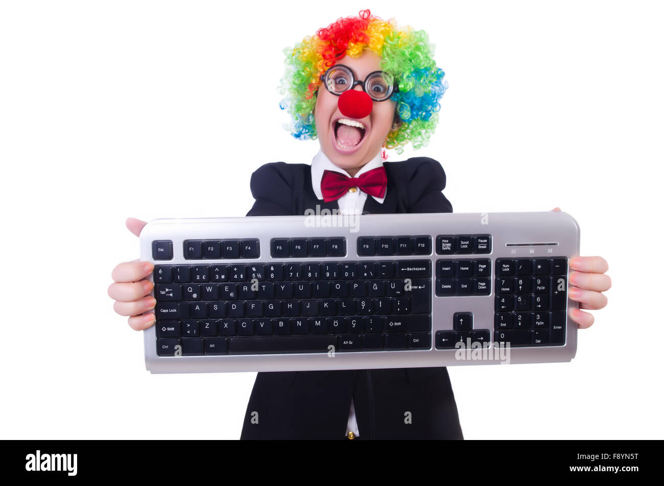 Funny clown with keyboard on white Stock Photo - Alamy