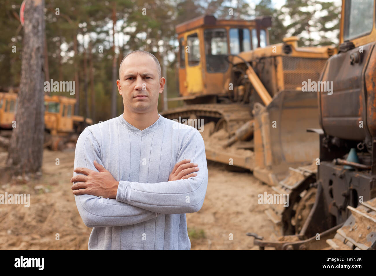 Portrait of tractor operator at workplace Stock Photo - Alamy