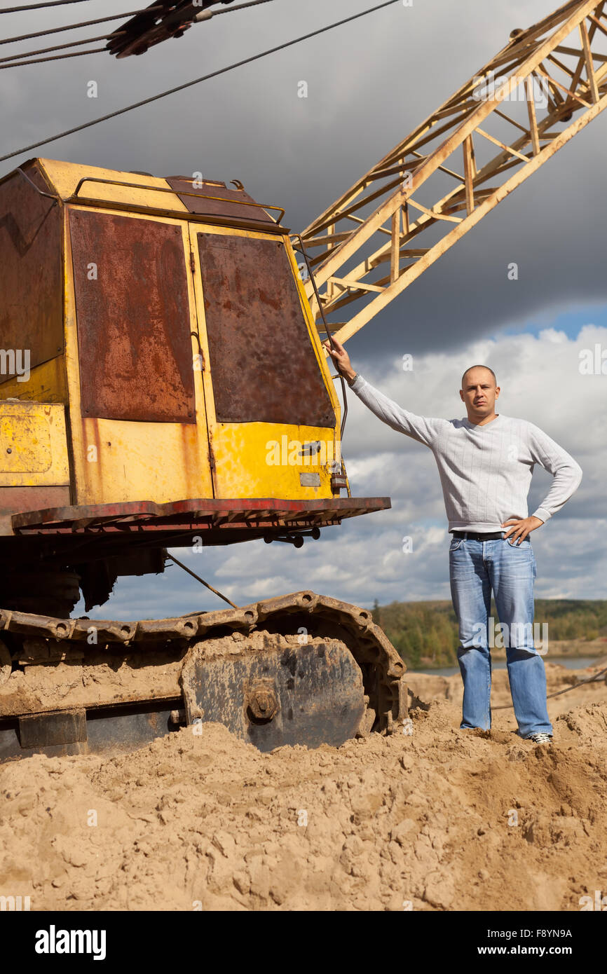Portrait of tractor operator at sand pit Stock Photo - Alamy