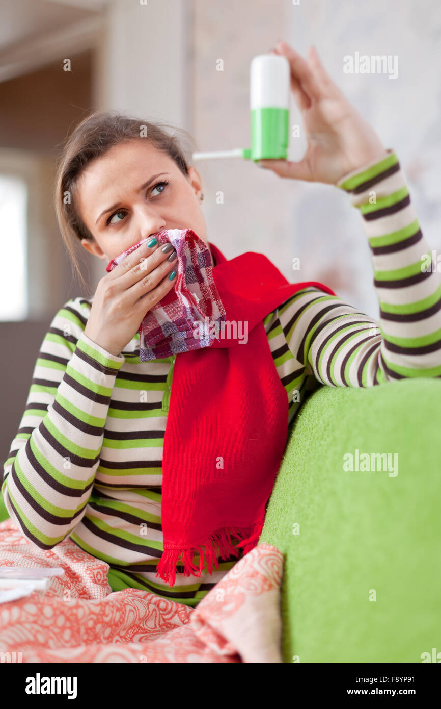 illness woman in warm scarf with spray Stock Photo - Alamy
