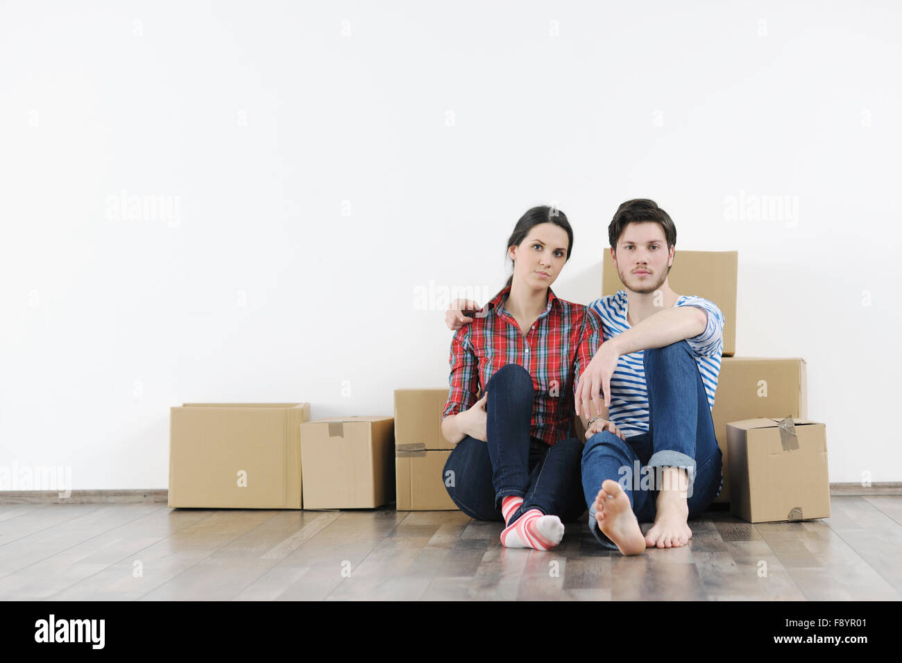 happy Young couple moving in new home Stock Photo - Alamy