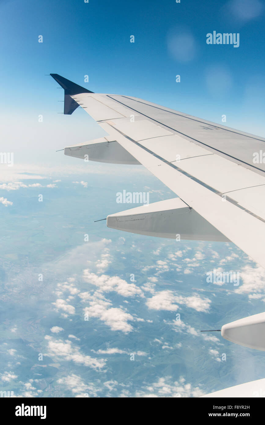 Airplane wing out of window Stock Photo - Alamy