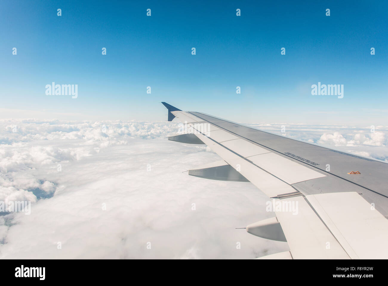 Airplane wing out of window Stock Photo - Alamy