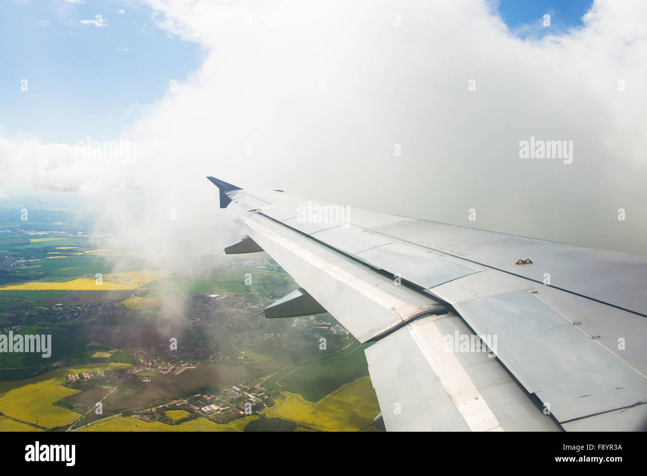 Airplane wing out of window Stock Photo - Alamy