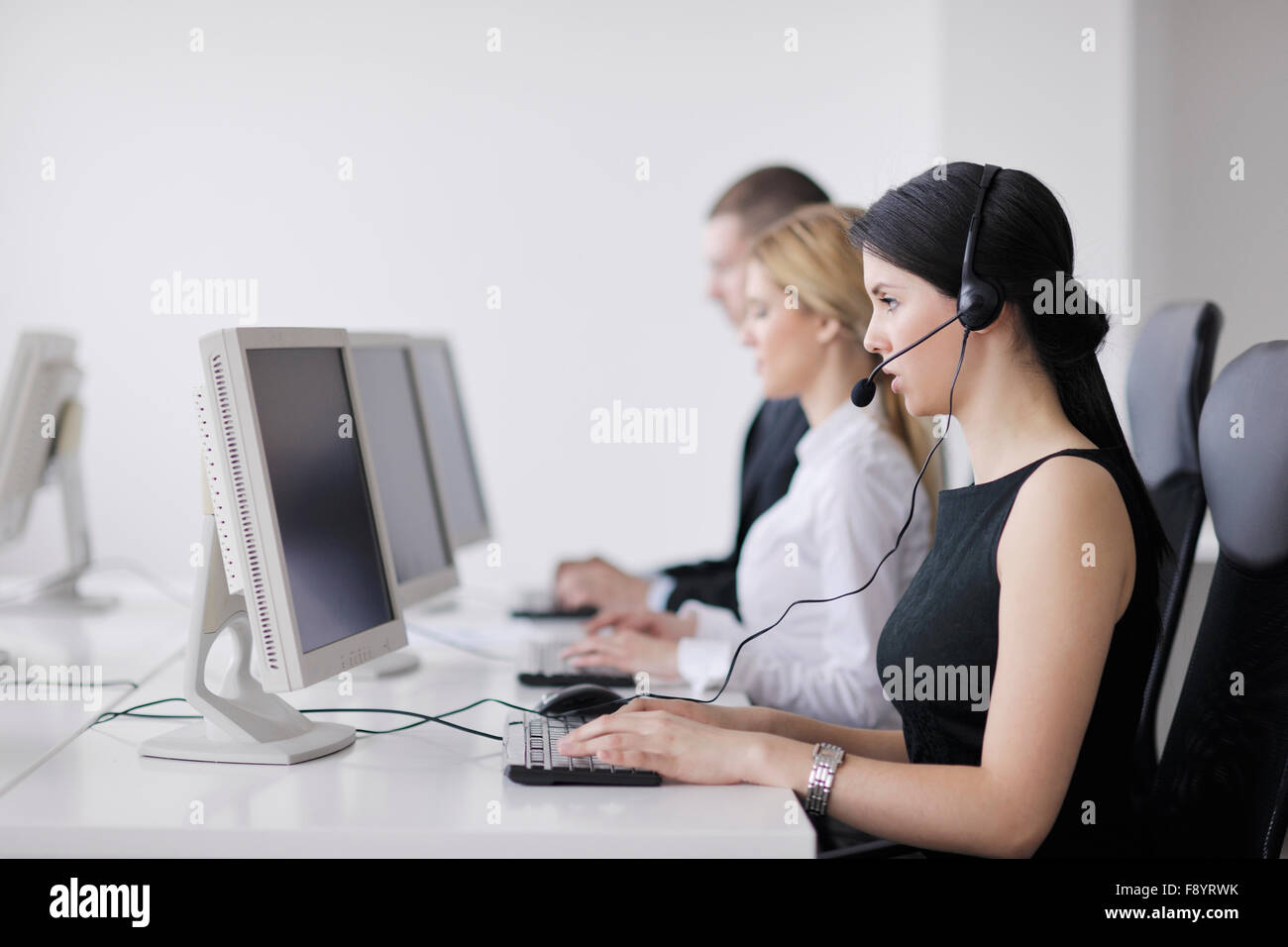 business people group with headphones giving support in help desk ...