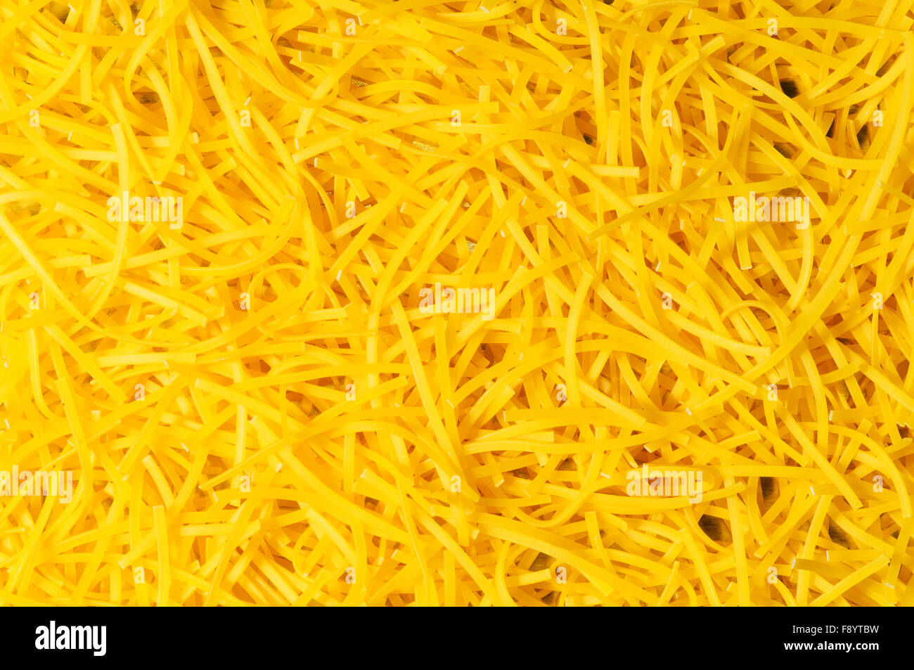 Extreme close up of yellow italian pasta Stock Photo - Alamy