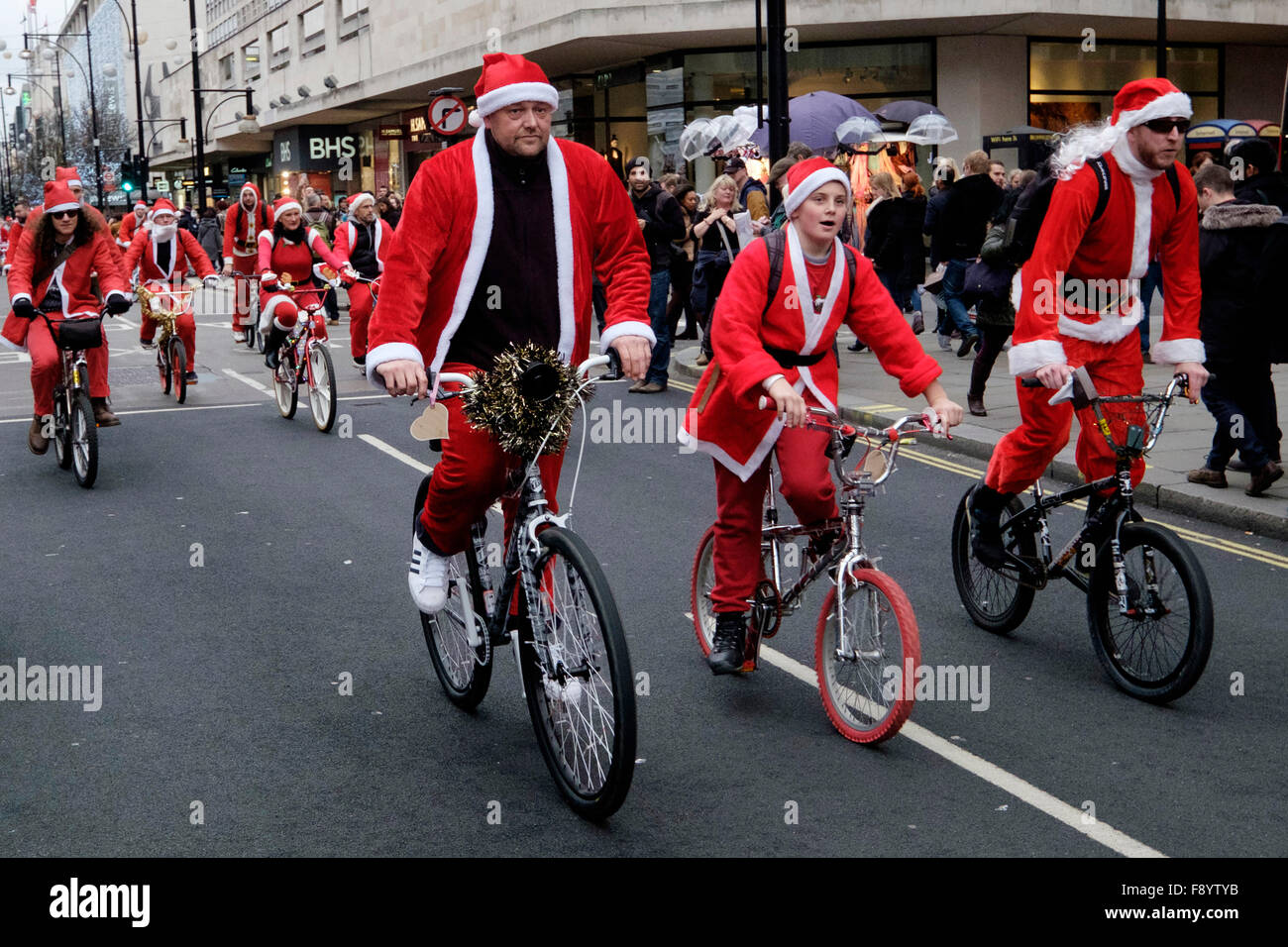 BMX bikers dressed as Santa Clause ride down Oxford Street Stock Photo ...