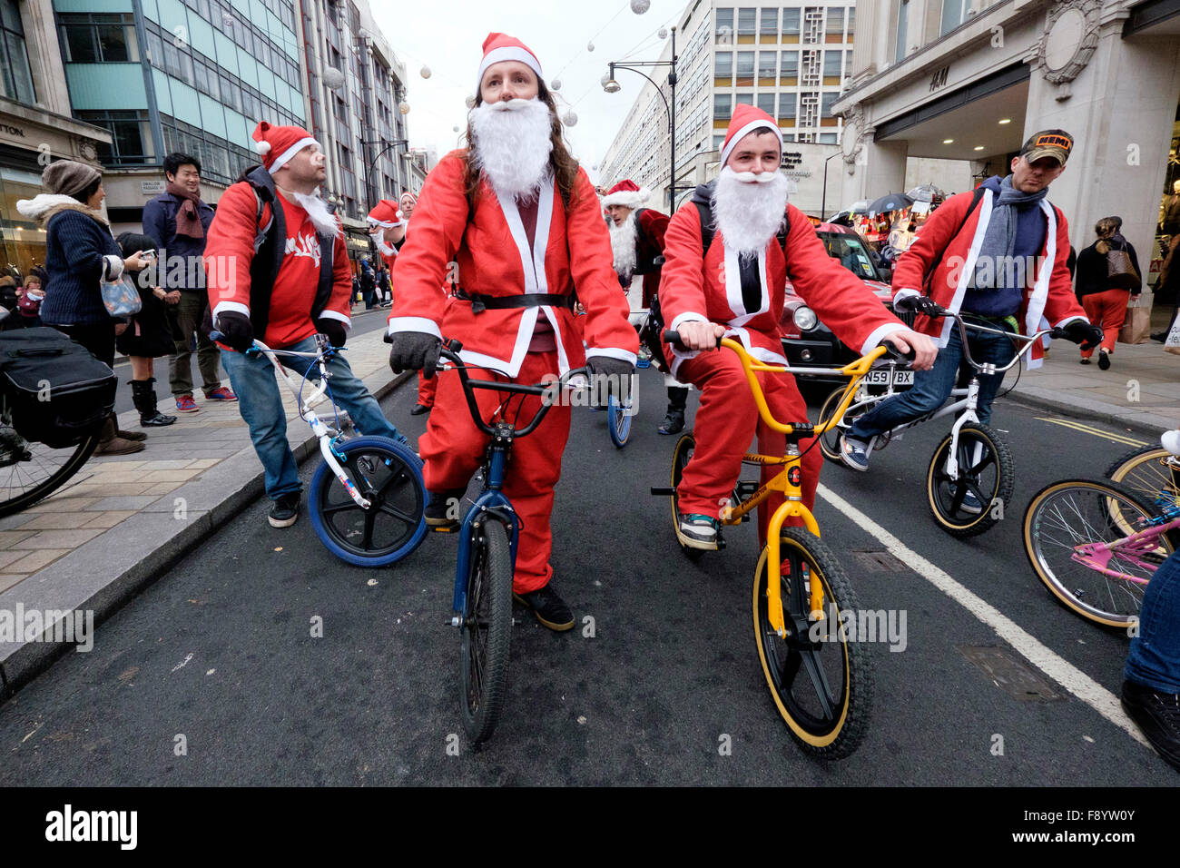 BMX bikers dressed as Santa Clause ride down Oxford Street Stock Photo ...