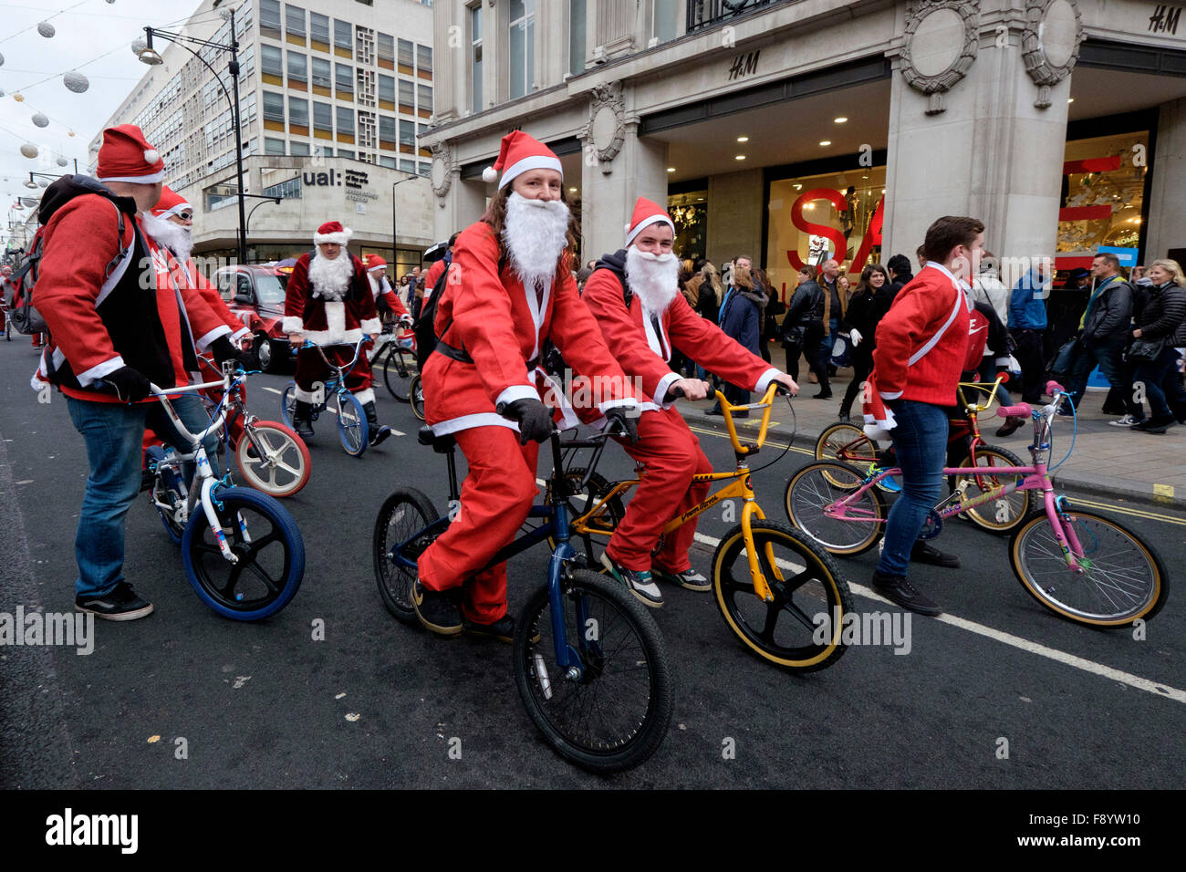 BMX bikers dressed as Santa Clause ride down Oxford Street Stock Photo ...