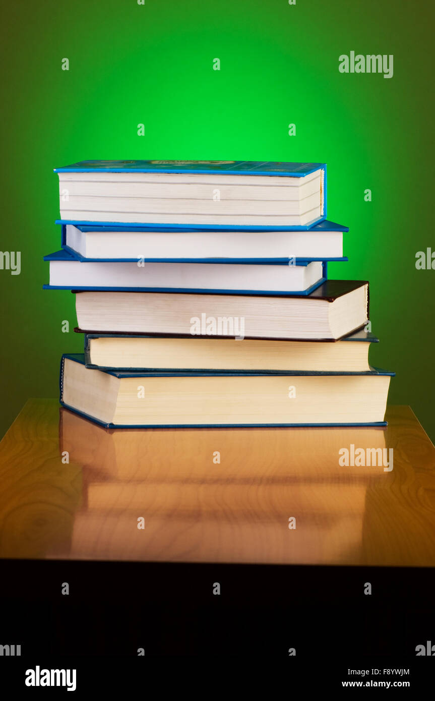 Stack of books against gradient background Stock Photo - Alamy