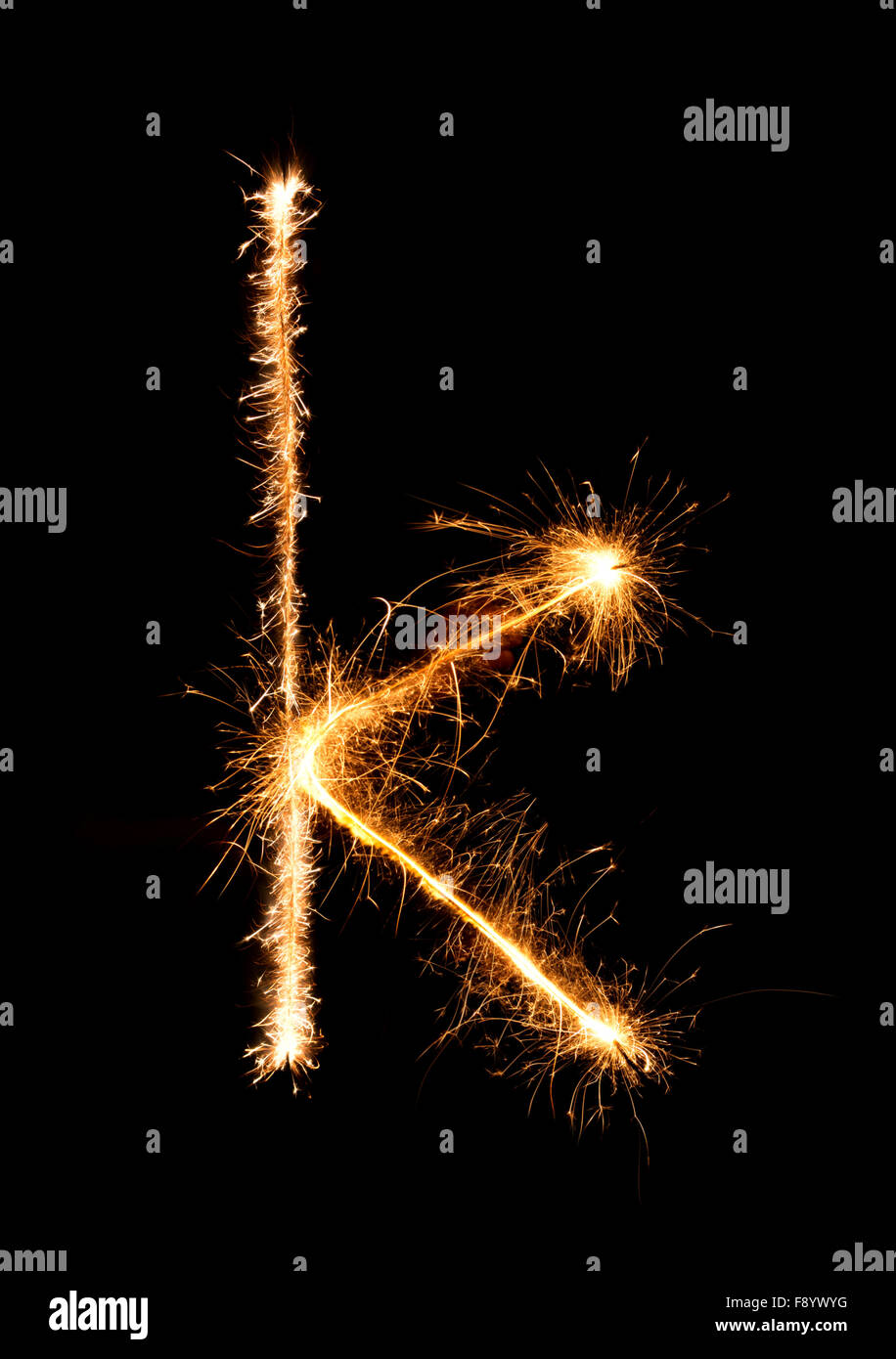 Sparkler firework light alphabet k (Small Letters) at night background ...