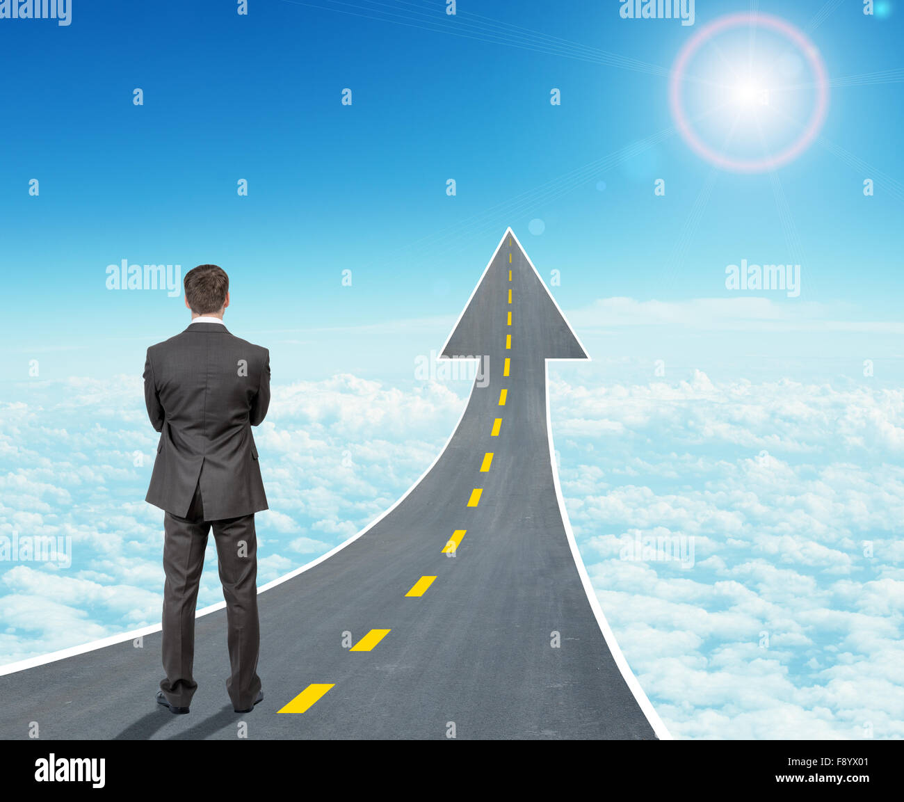 Person standing on freeway road going up as arrow Stock Photo - Alamy