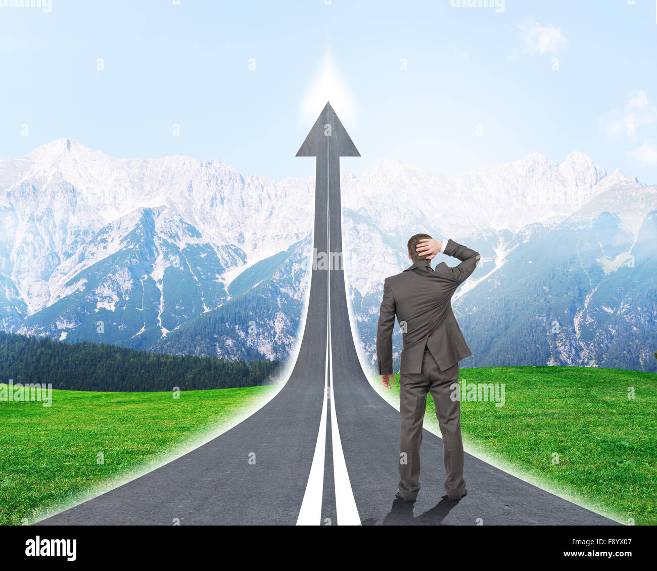 Person standing on highway road going up as arrow Stock Photo - Alamy
