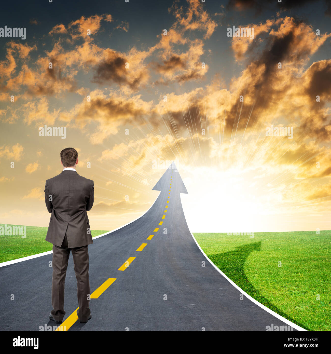 Man standing on roadway going up as arrow Stock Photo - Alamy