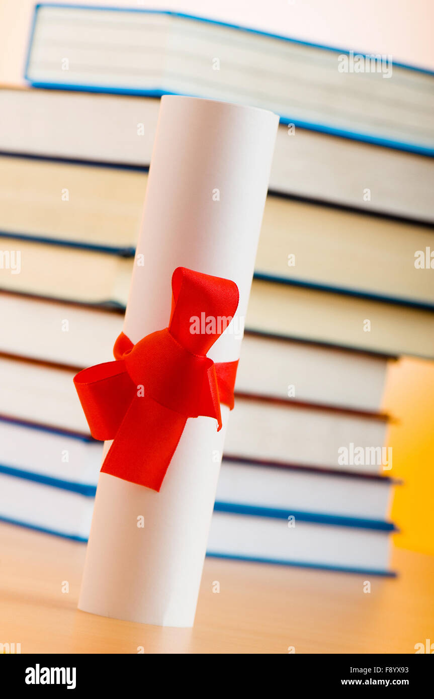 Diploma and stack of books against the background Stock Photo - Alamy