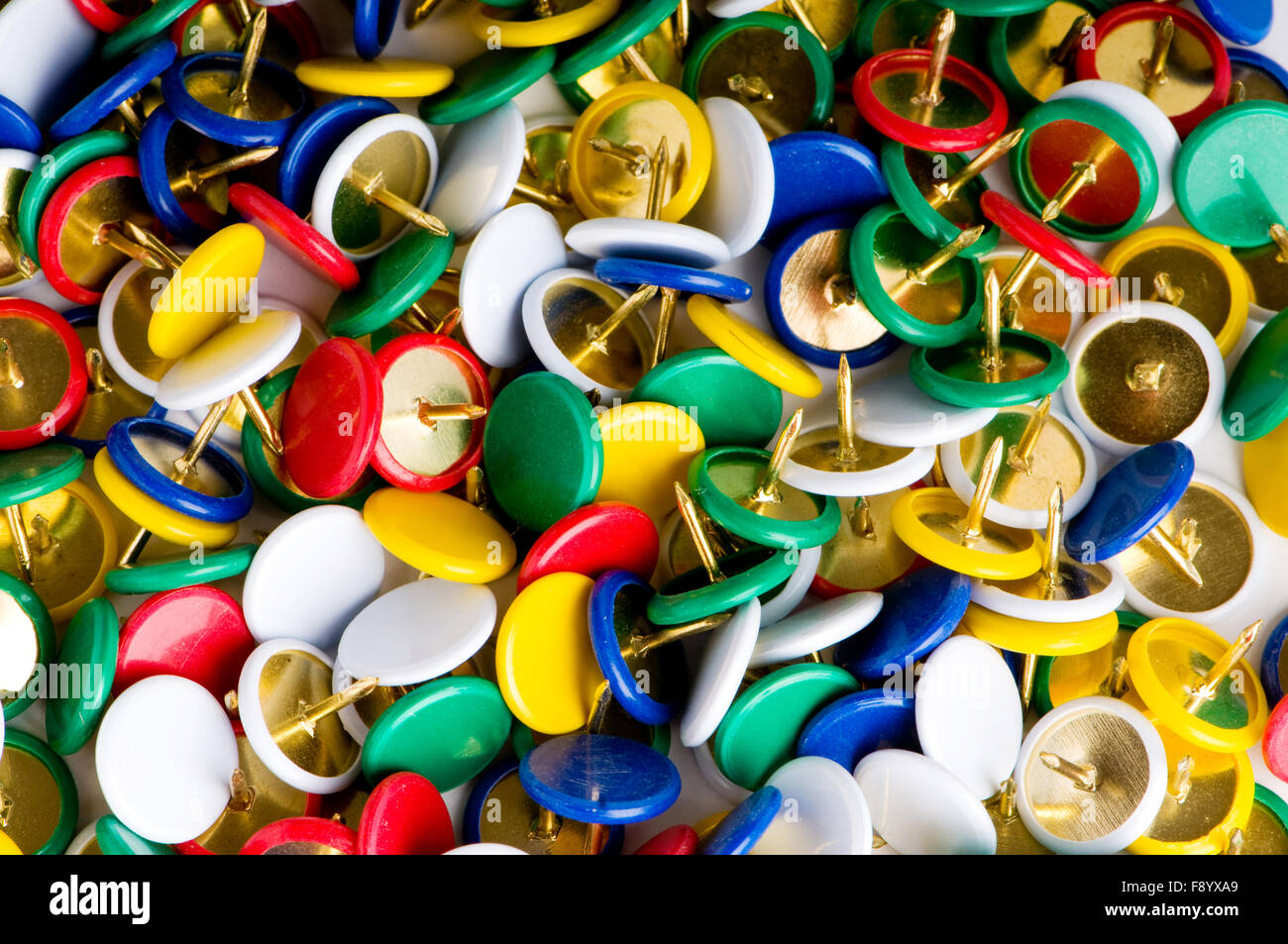Many colourful office pins on the background Stock Photo - Alamy
