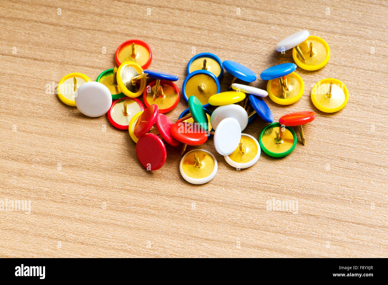 Many colourful office pins on the background Stock Photo - Alamy