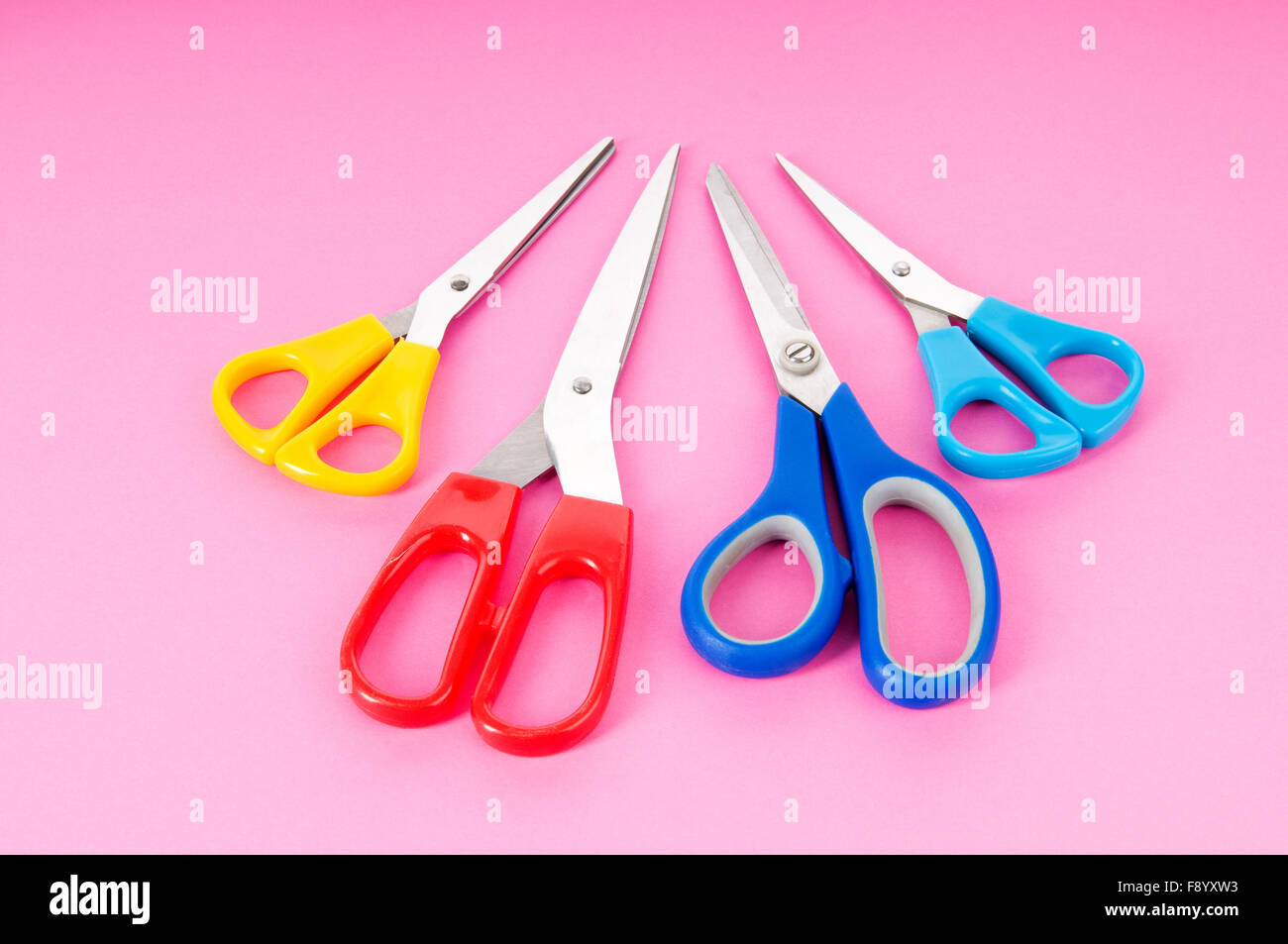 Colorful scissors on the color paper background Stock Photo - Alamy