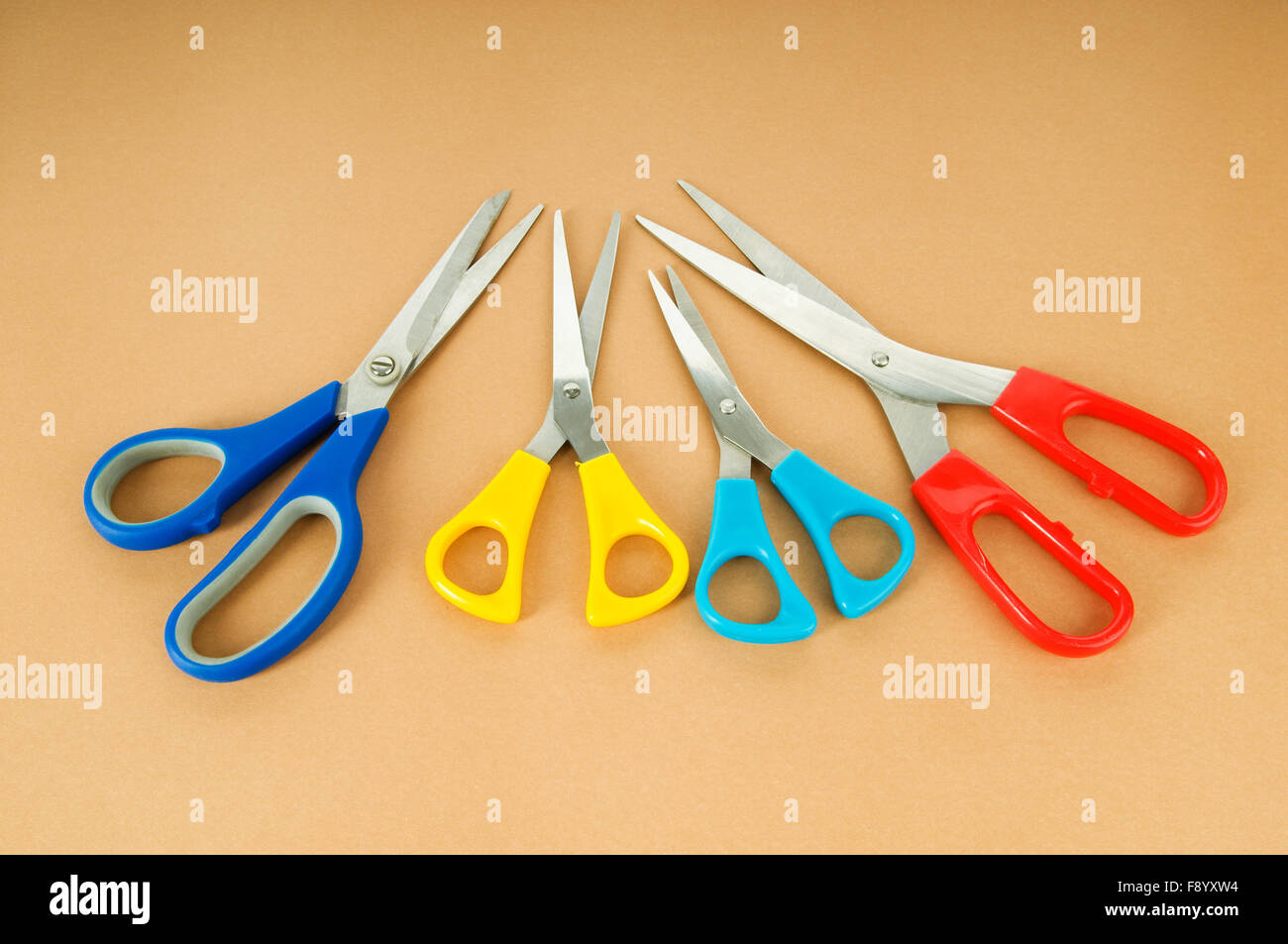 Colorful scissors on the color paper background Stock Photo - Alamy