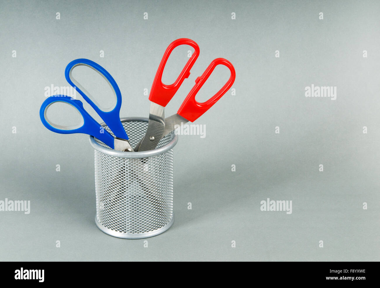 Colorful scissors on the color paper background Stock Photo - Alamy