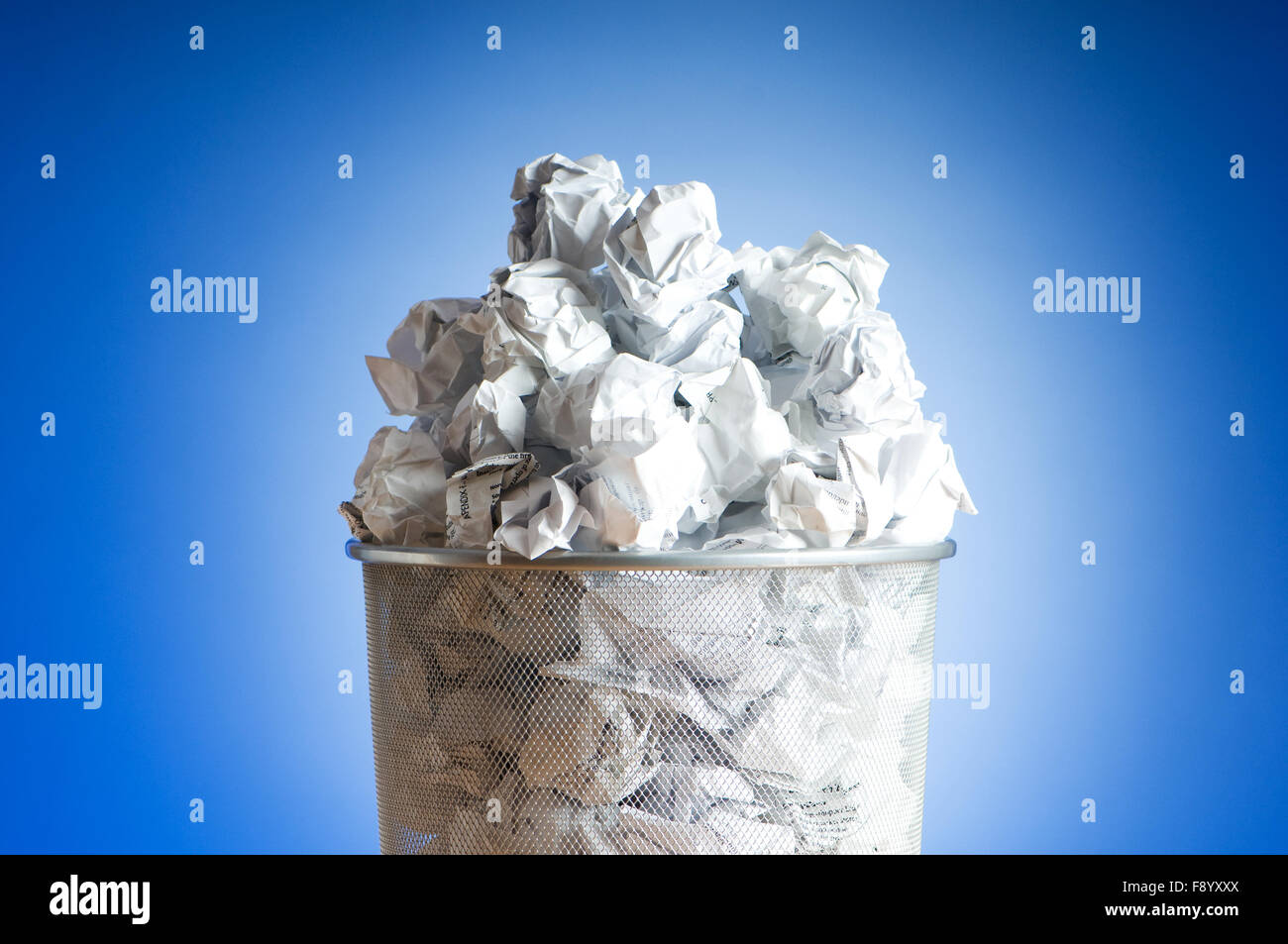 Garbage bin with paper waste isolated on white Stock Photo - Alamy
